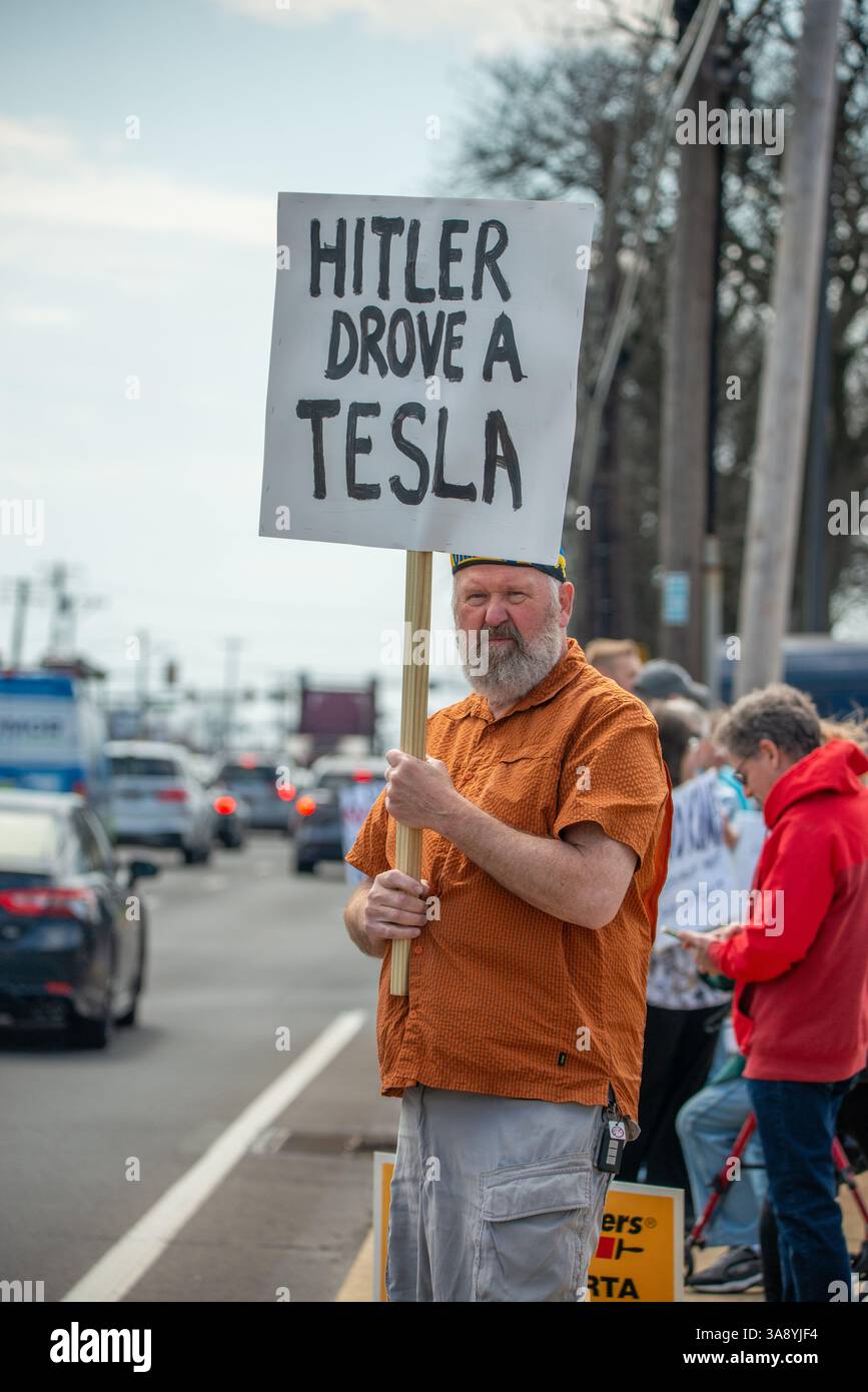 People wave flags during a rally against US President Trump, Elon Musk ...