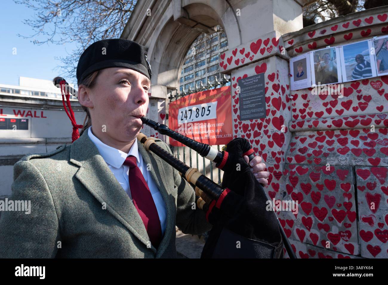 London, UK. 29 March, 2025. Bagpiper Iona Scotson leads a procession of ...