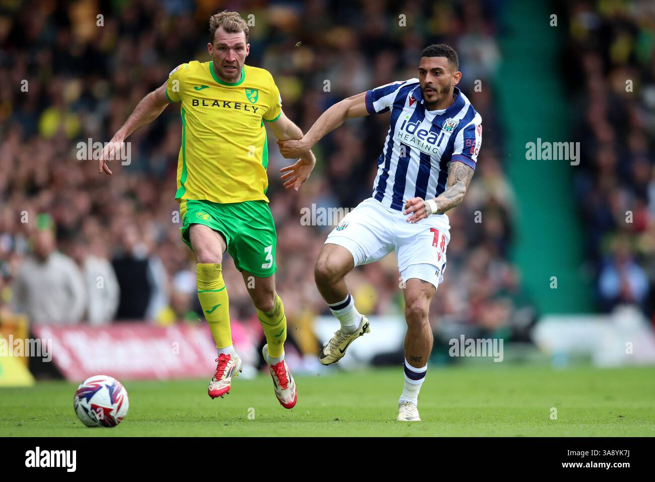 Norwich City's Jack Stacey battles for the ball against West Bromwich ...
