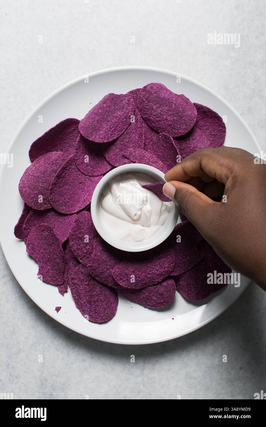Overhead view of purple sweet potato chips and dip, top view of ube ...
