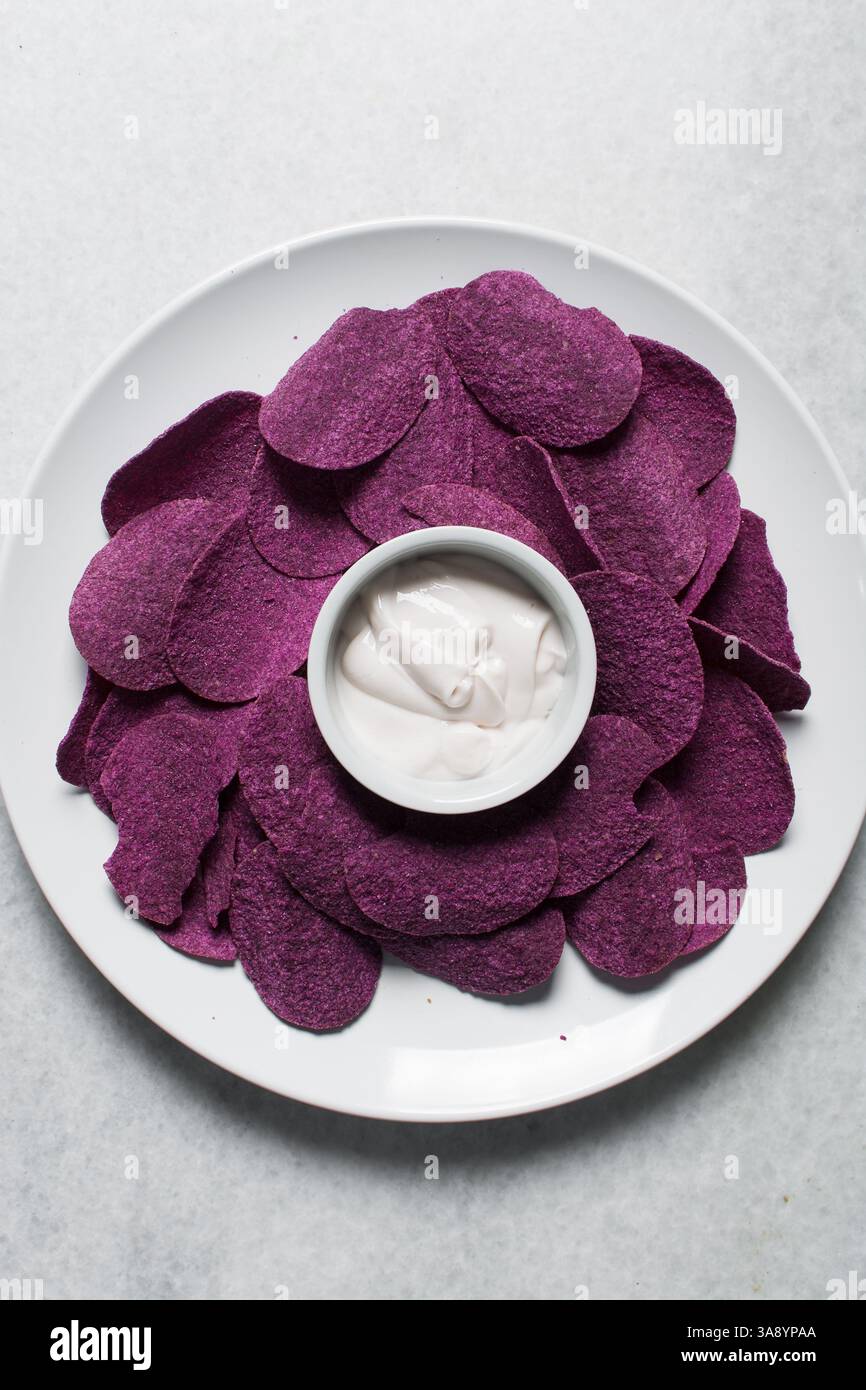 Overhead view of purple sweet potato chips and dip, top view of ube ...