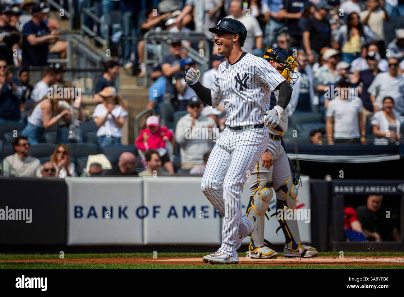 New York Yankees' Cody Bellinger (35) smiles after crossing home plate ...