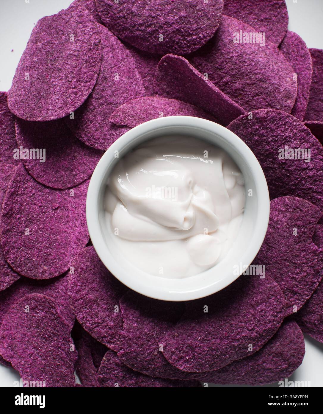 Overhead view of purple sweet potato chips and dip, top view of ube ...