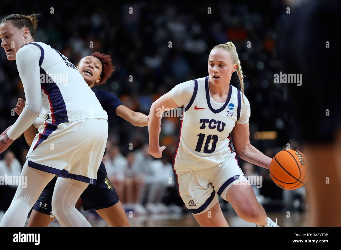 TCU guard Hailey Van Lith (10) moves the ball down court against Notre ...