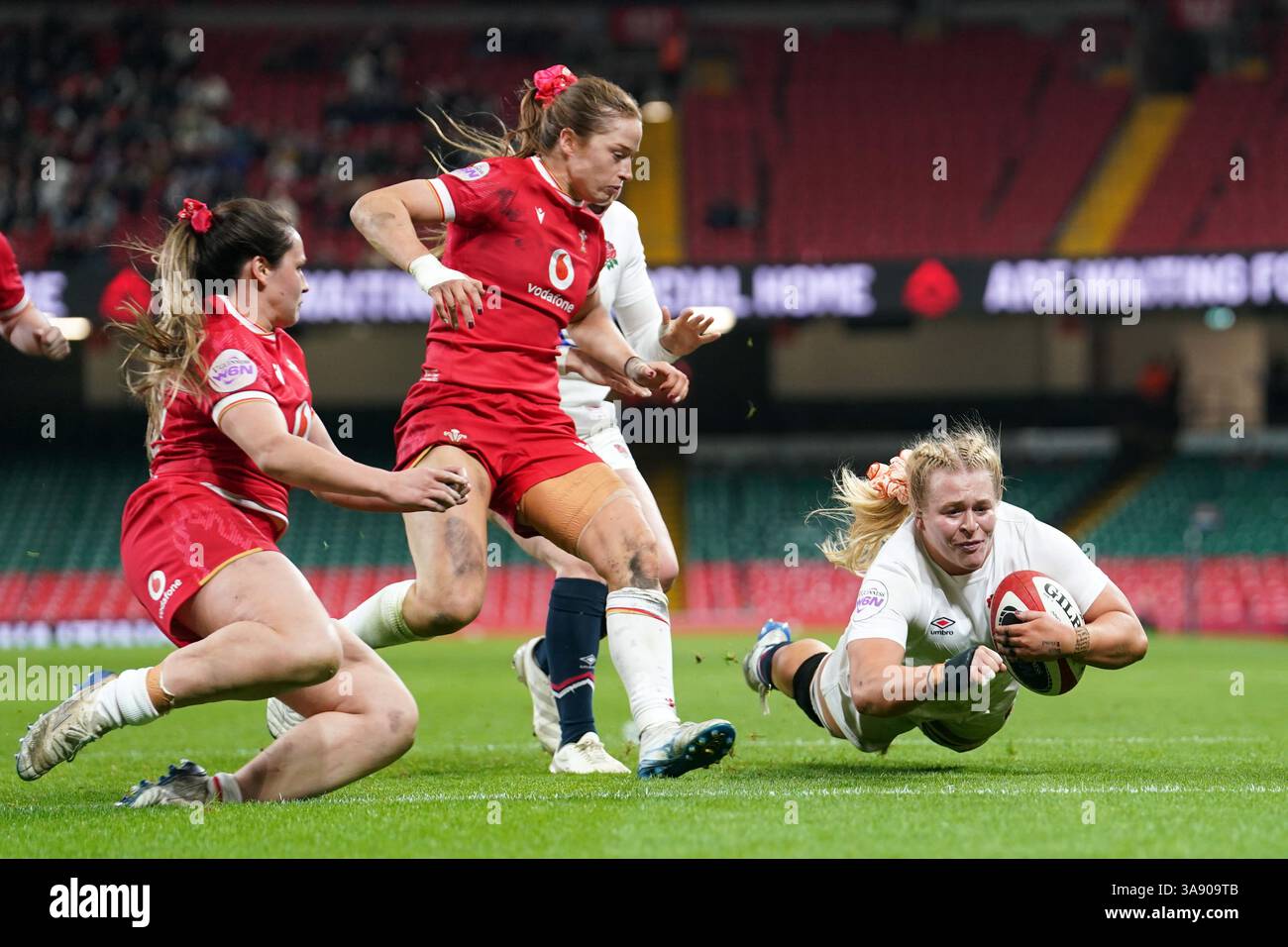 England’s Abi Burton (right) scores their side’s sixth try of the game ...