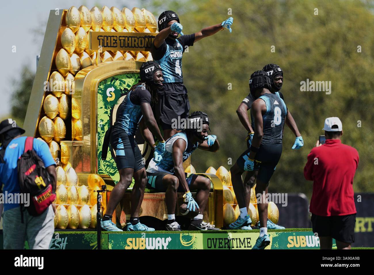 Raw Miami celebrates on a throne by the end zone after an interception ...