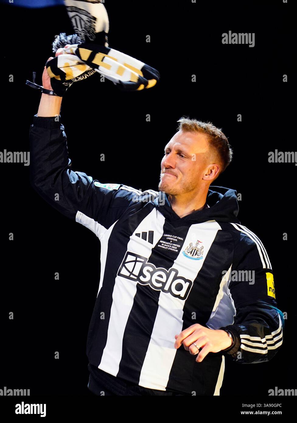 Newcastle United's Dan Burn on stage during the Carabao Cup trophy ...