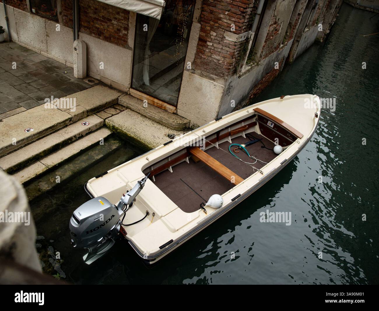 Venice Canal Boat: Parked by Historic Building Stock Photo - Alamy
