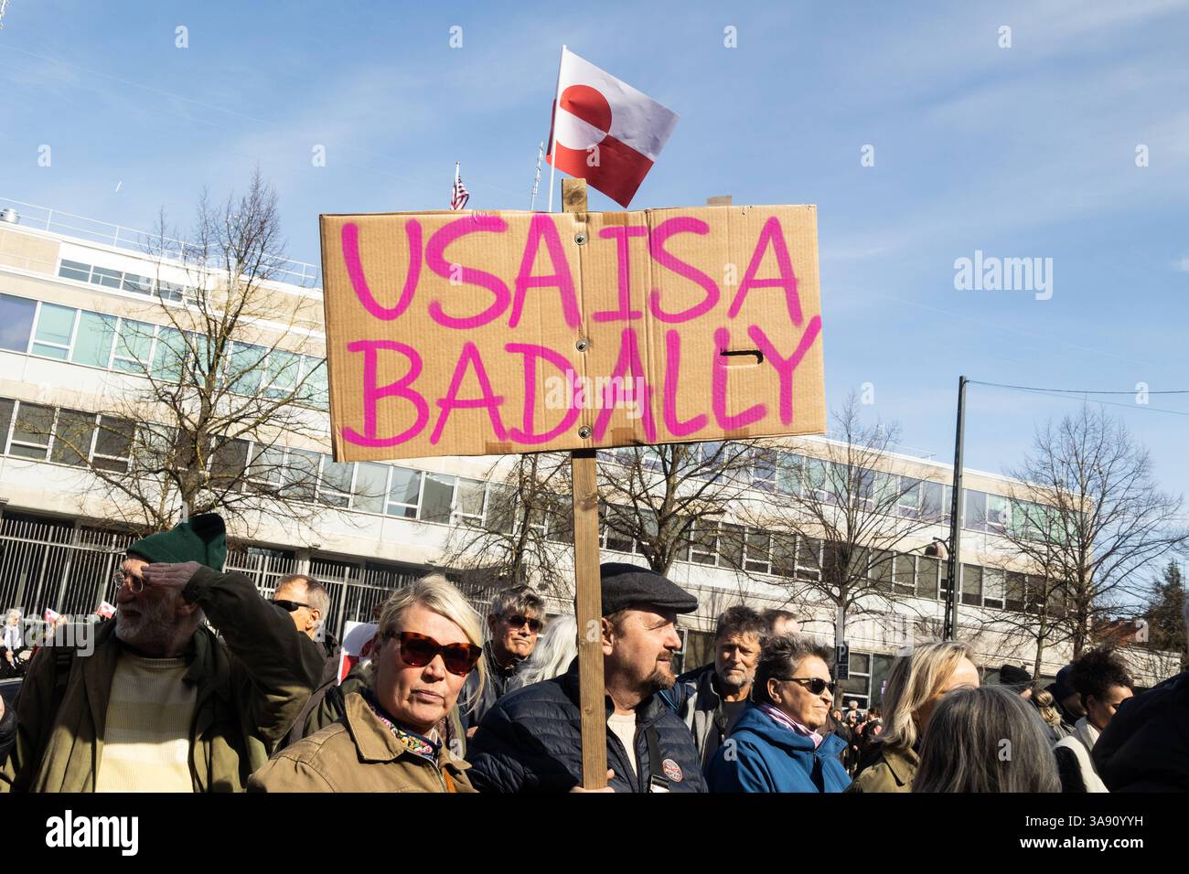 A protester holds a sign that reads USA IS A BAD ALLY during a ...