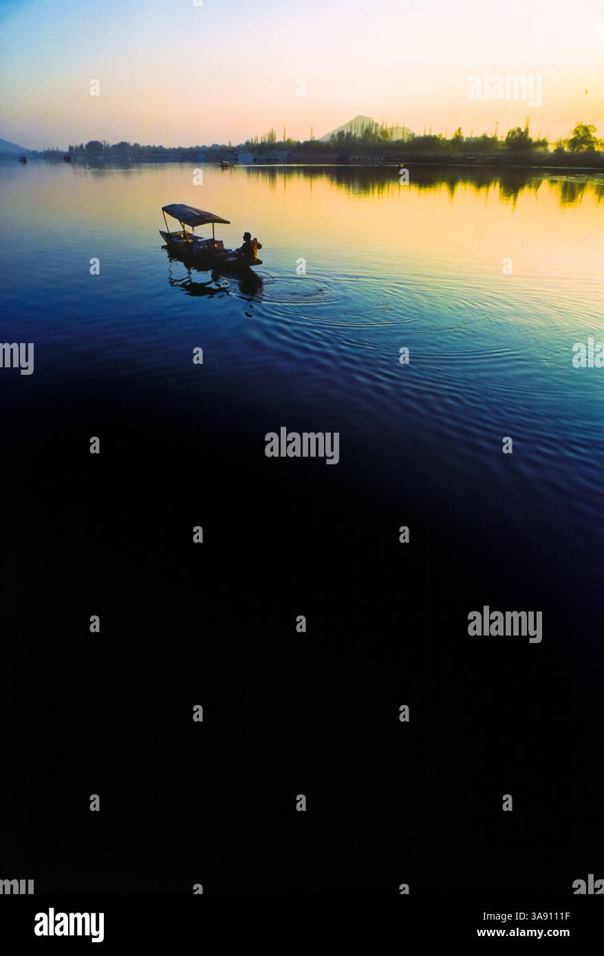 Shikara or wooden boat (a Kashmir cultural symbol) on Nagin Lake. late ...