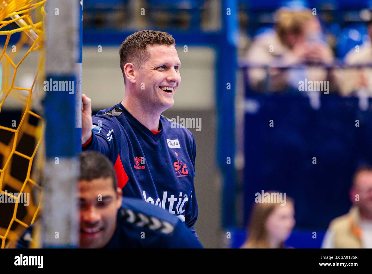Kevin Moeller (SG Flensburg-Handewitt, #20) laechelt / freut sich GER ...