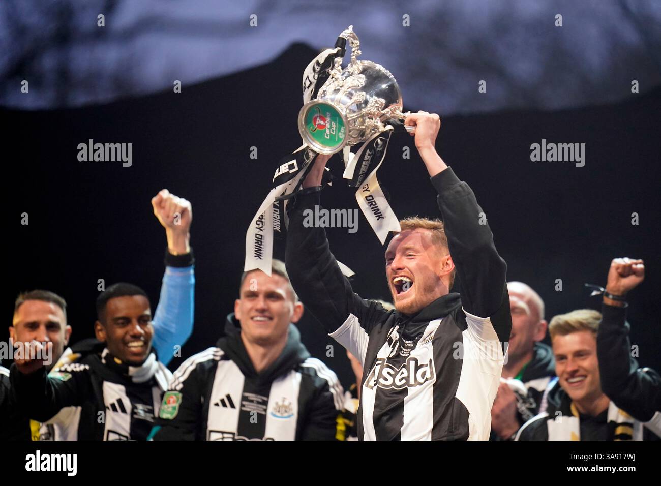Newcastle United's Sean Longstaff on stage with the Carabao Cup during ...