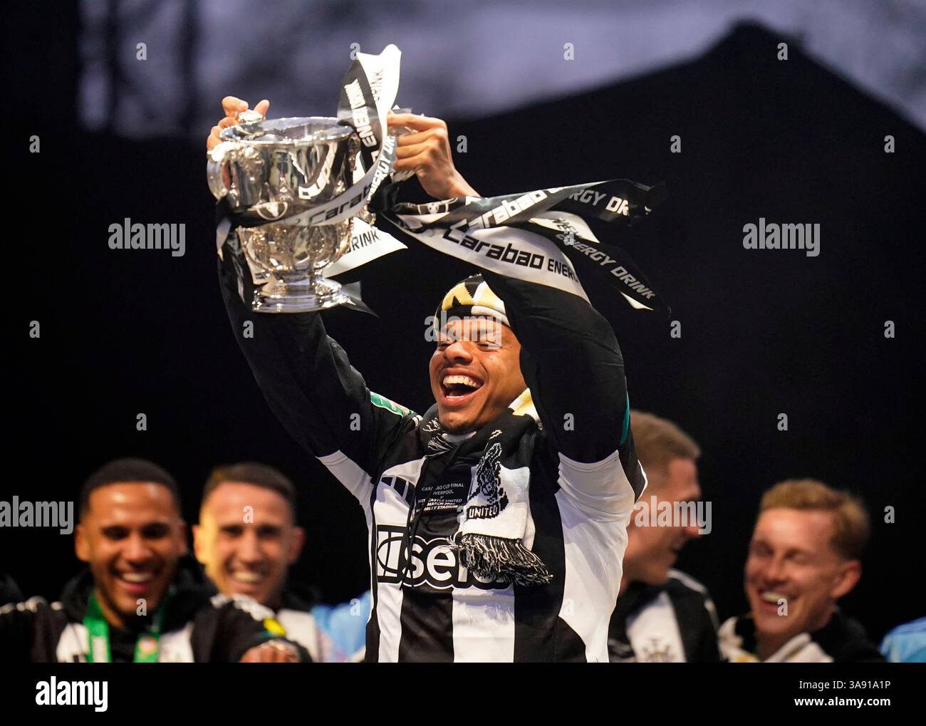 Newcastle United's William Osula on stage with the Carabao Cup during ...
