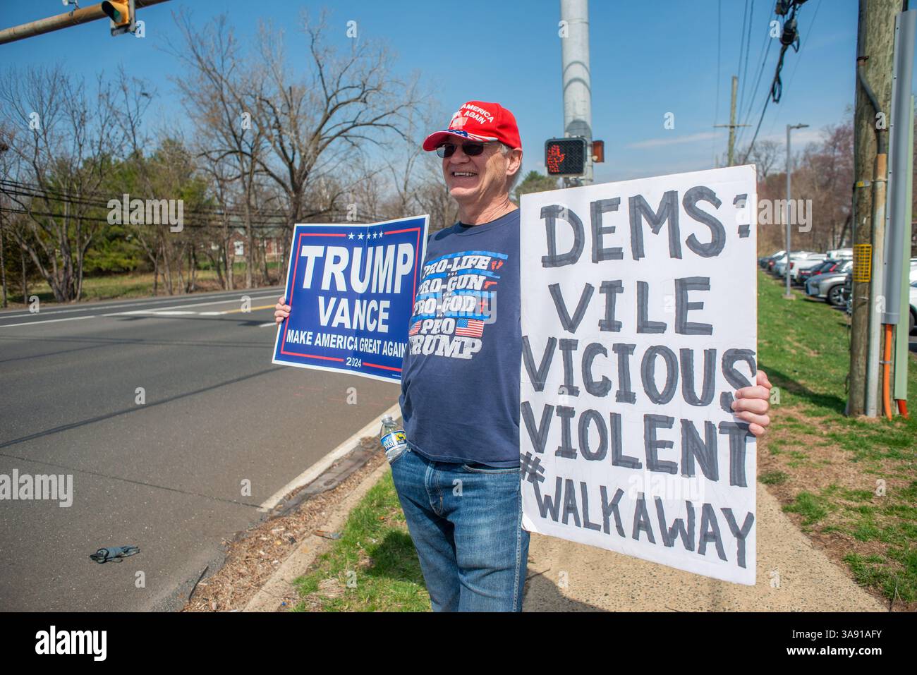 People wave flags during a rally in support of US President Trump, Elon ...