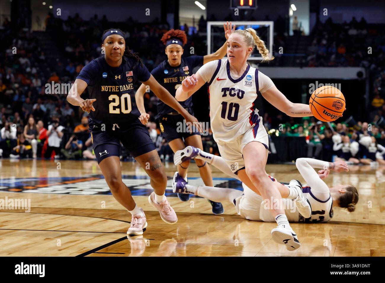 TCU guard Hailey Van Lith (10) drives to the basket around Notre Dame ...
