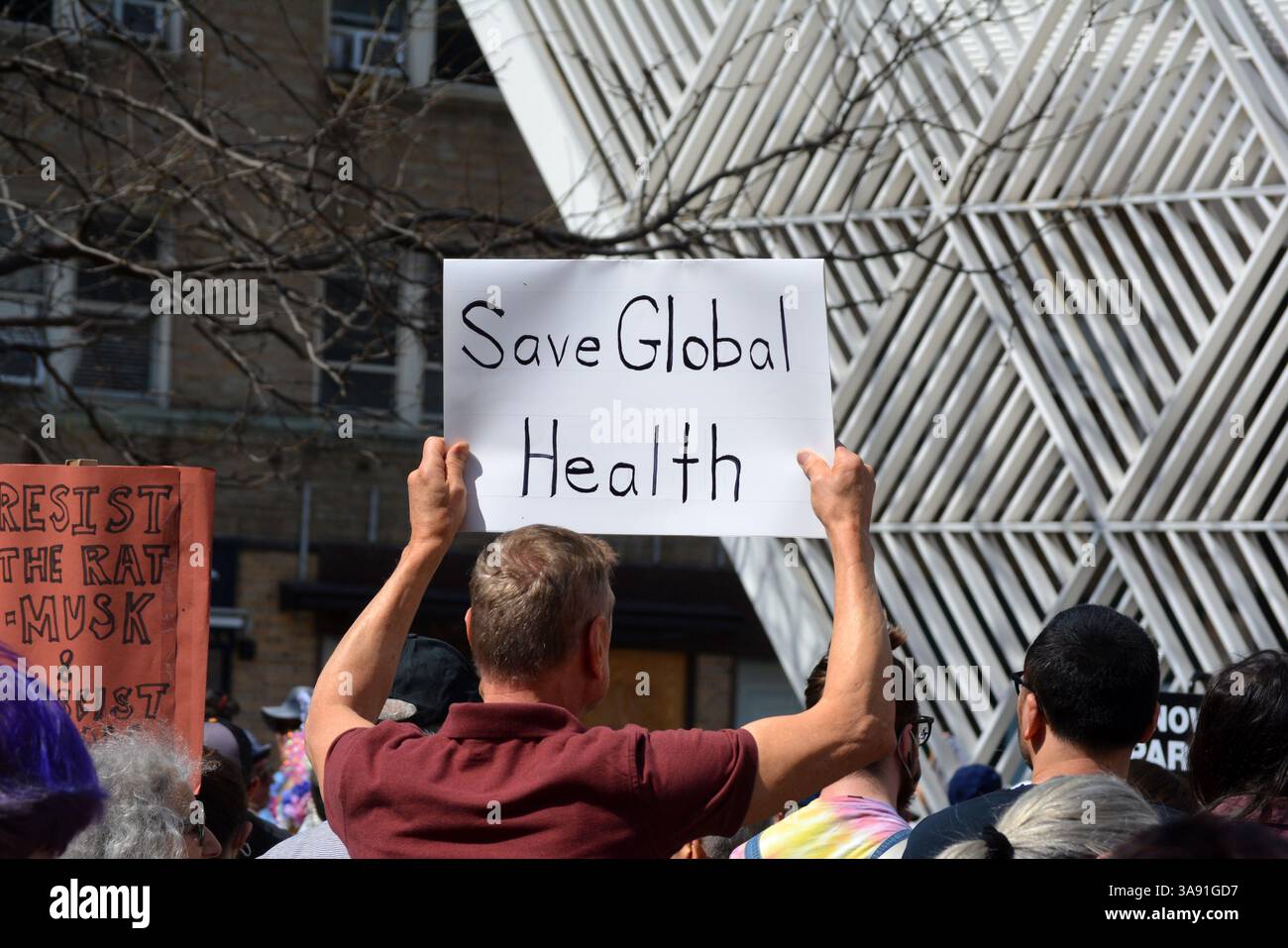 Tesla Takedown event against DOGE and Elon Musk marching to a Tesla ...