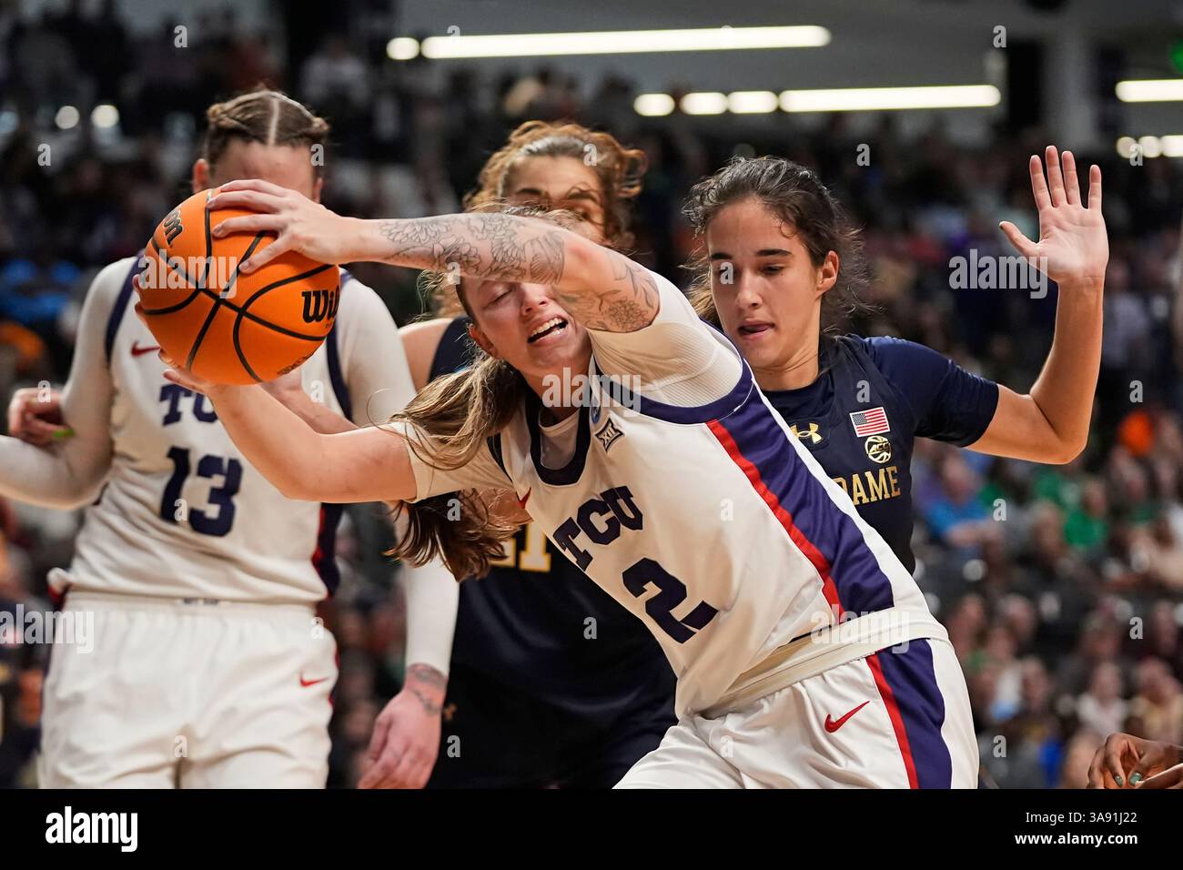 TCU guard Madison Conner (2) pulls down a rebound during the second ...