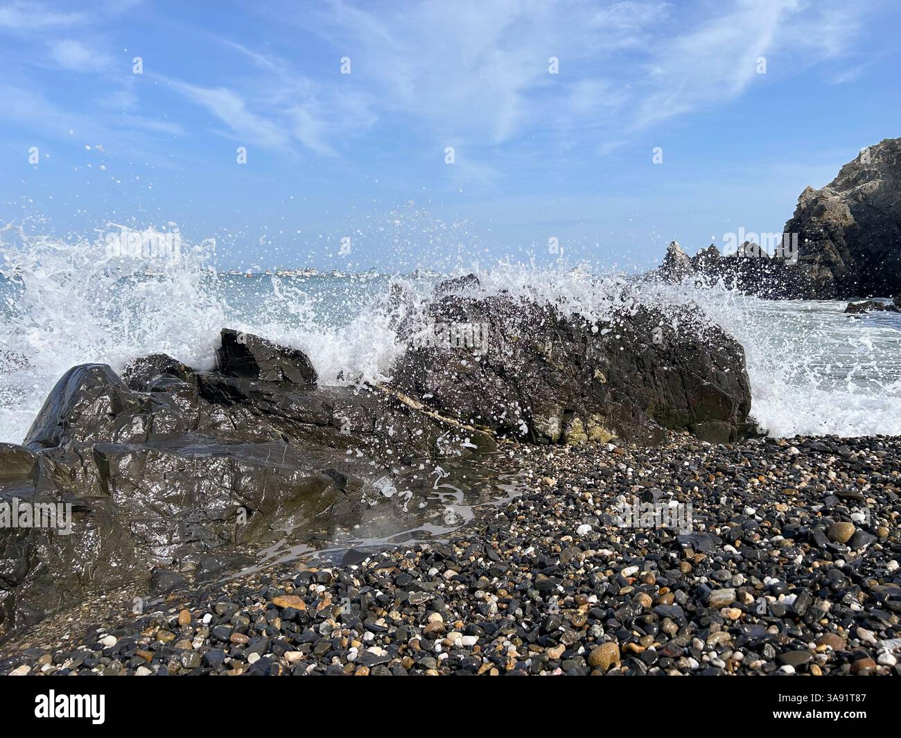 Dynamic Coastal Scene with Waves Crashing Against Jagged Rocks at ...