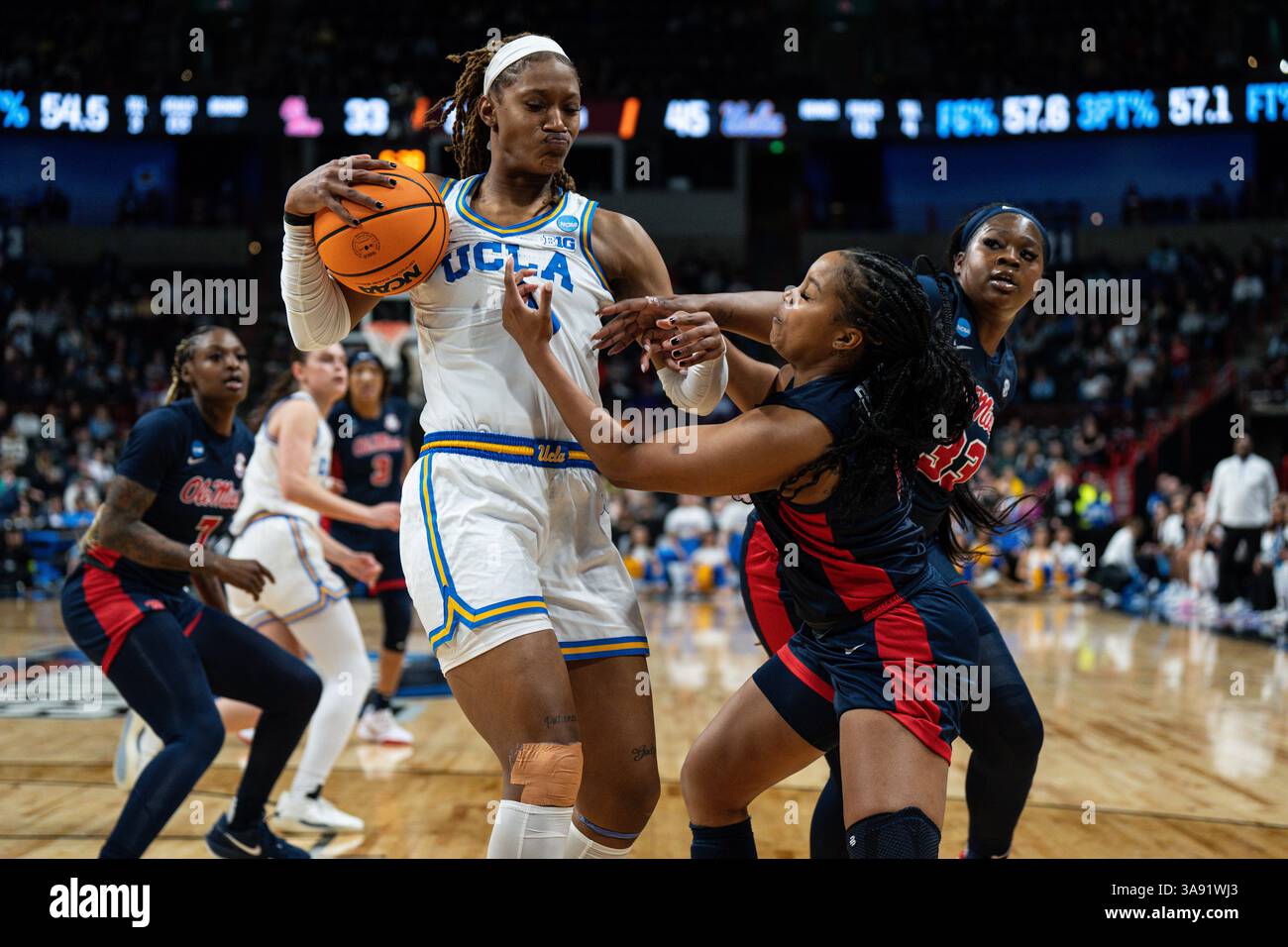 UCLA Bruins forward Janiah Barker (0) secures a rebound against Ole ...