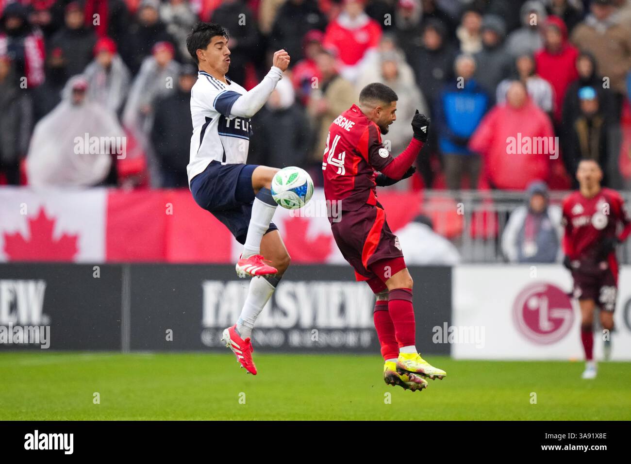 Vancouver Whitecaps defender Mathias Laborda (2) and Toronto FC forward Lorenzo Insigne (24 ...