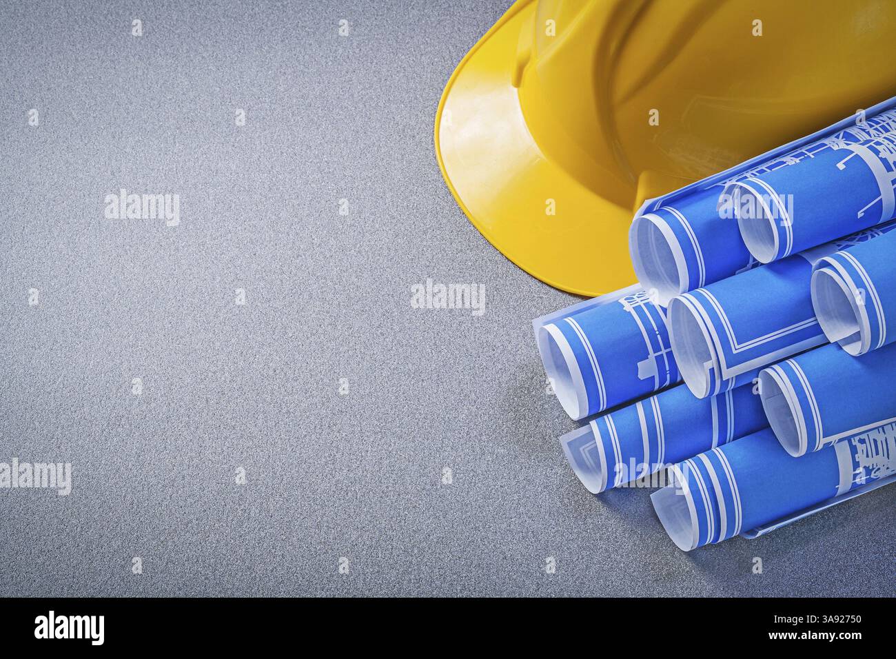 Hard hat blue engineering drawings on grey background construction ...