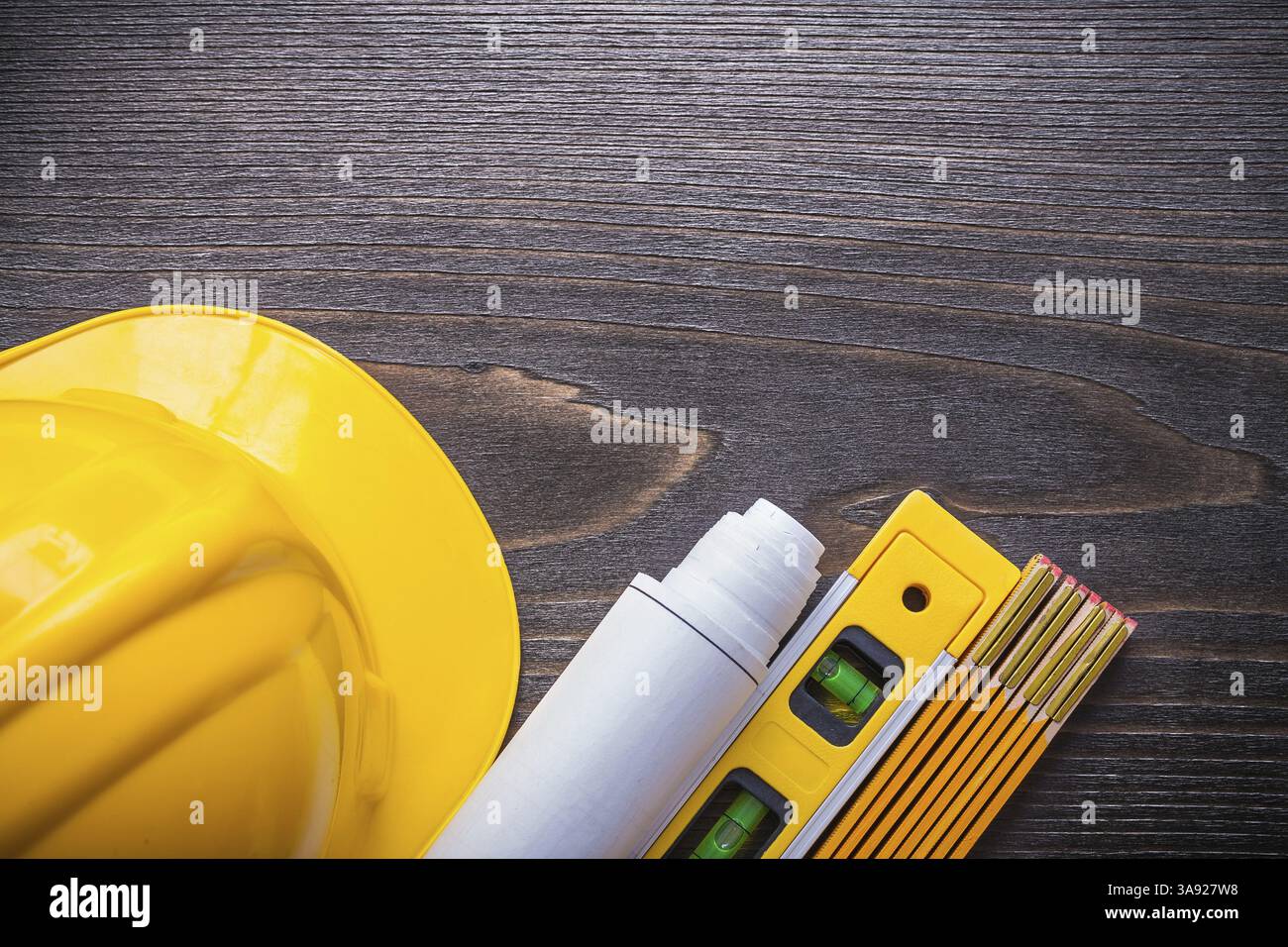 Horizontal view of blueprint roll construction level building helmet ...