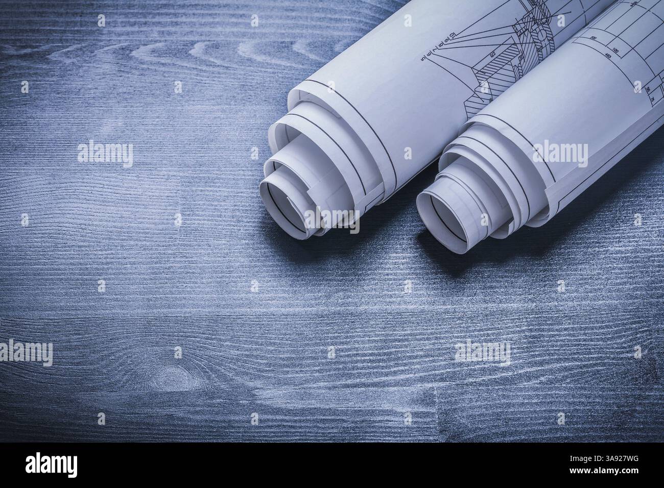 Two rolled white blueprints Stock Photo - Alamy