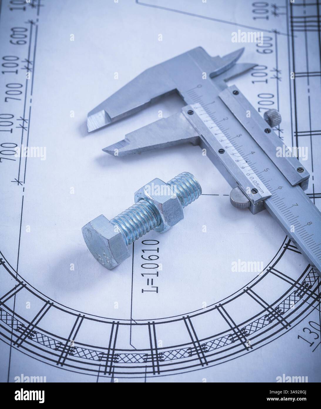 Stainless bolt with screw nut roller bearings on blueprint construction ...