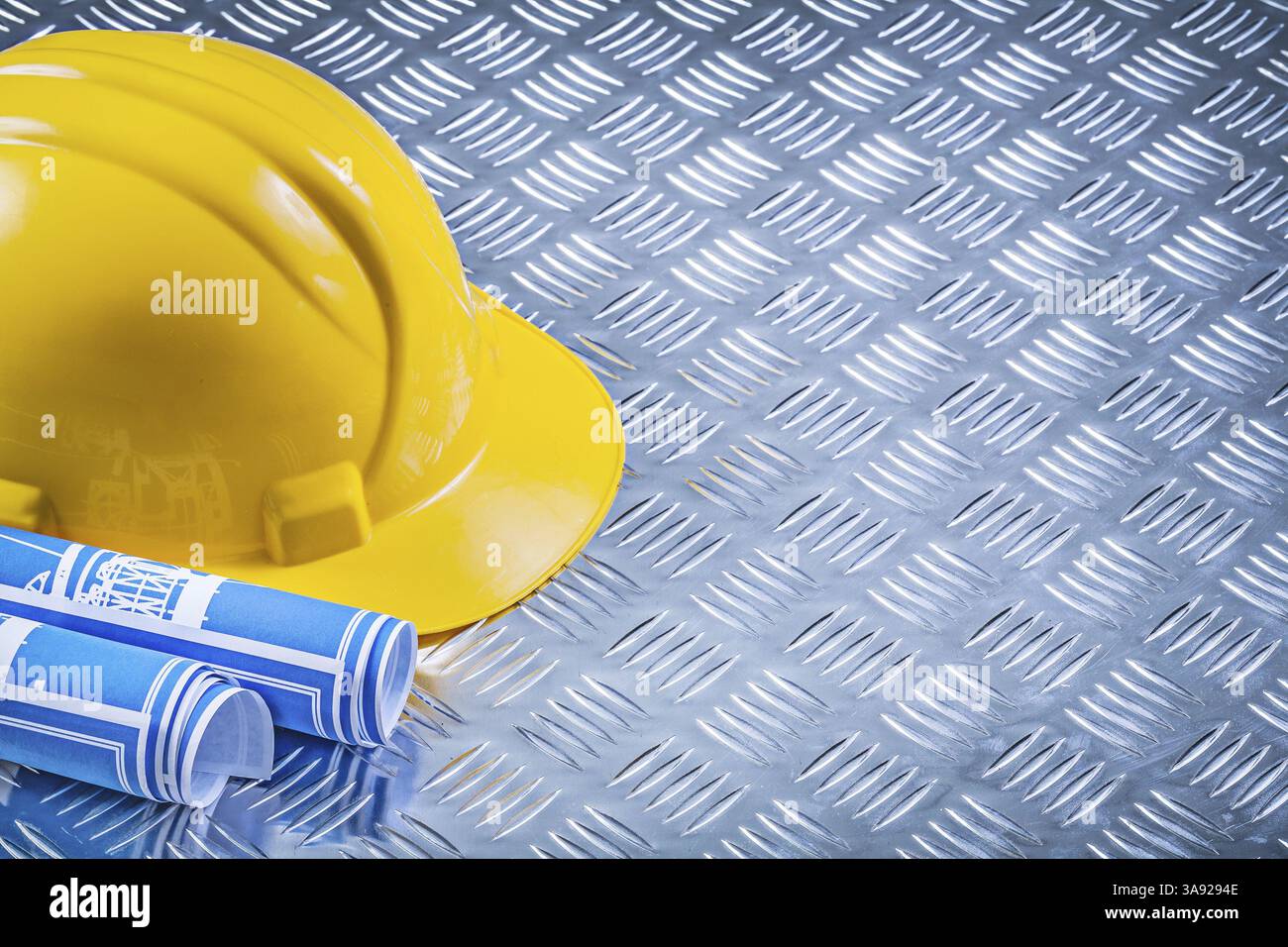 Blue engineering drawings building helmet on corrugated metal ...