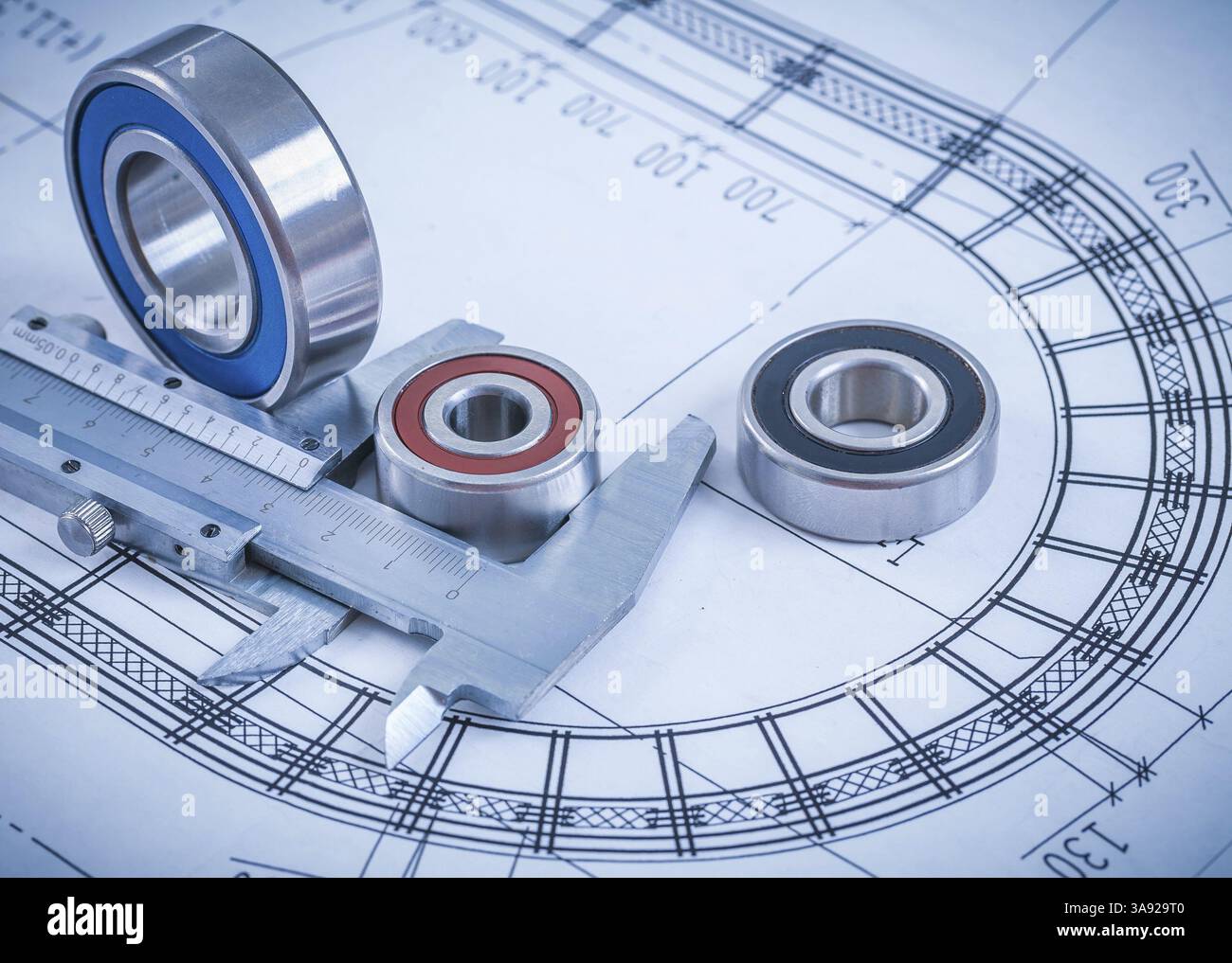 Stainless rolling bearings and slide caliper on blueprint construction ...