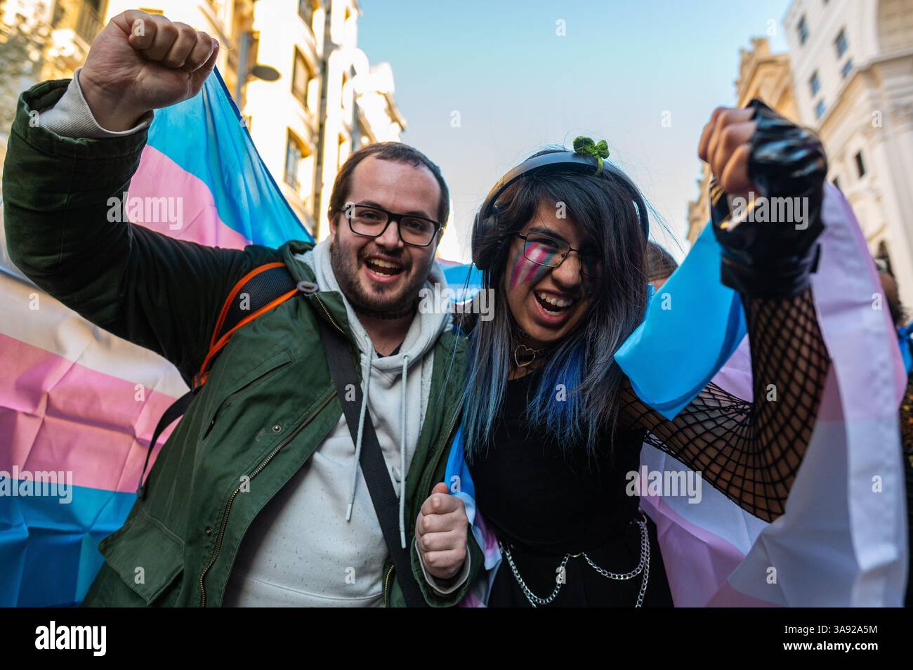 Madrid, Spain. 29th Mar, 2025. A couple shouting while carrying a Trans ...