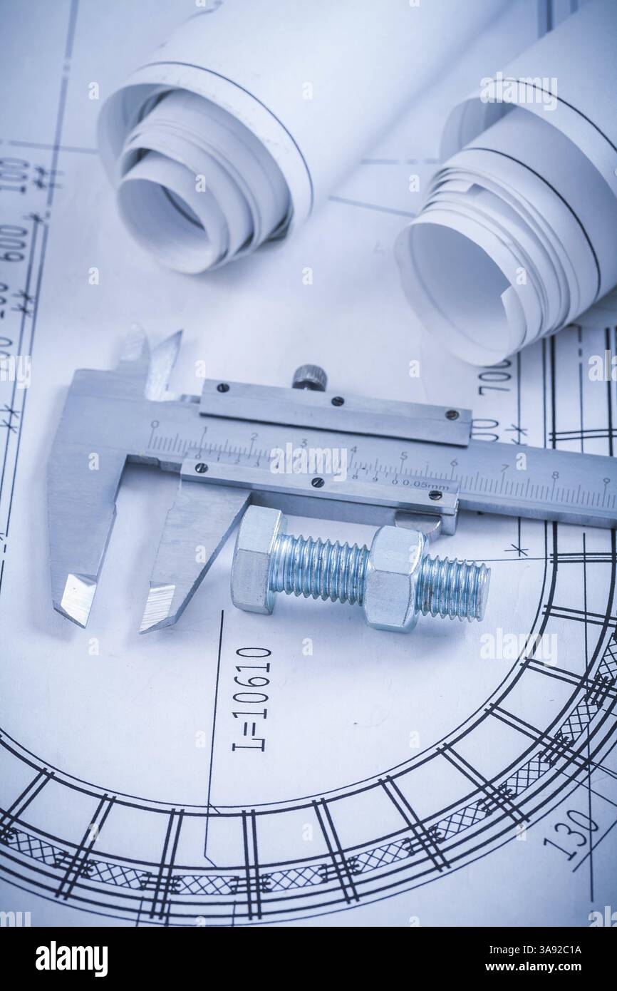 Stainless screw bolt with nut slide caliper rolls of construction plans ...