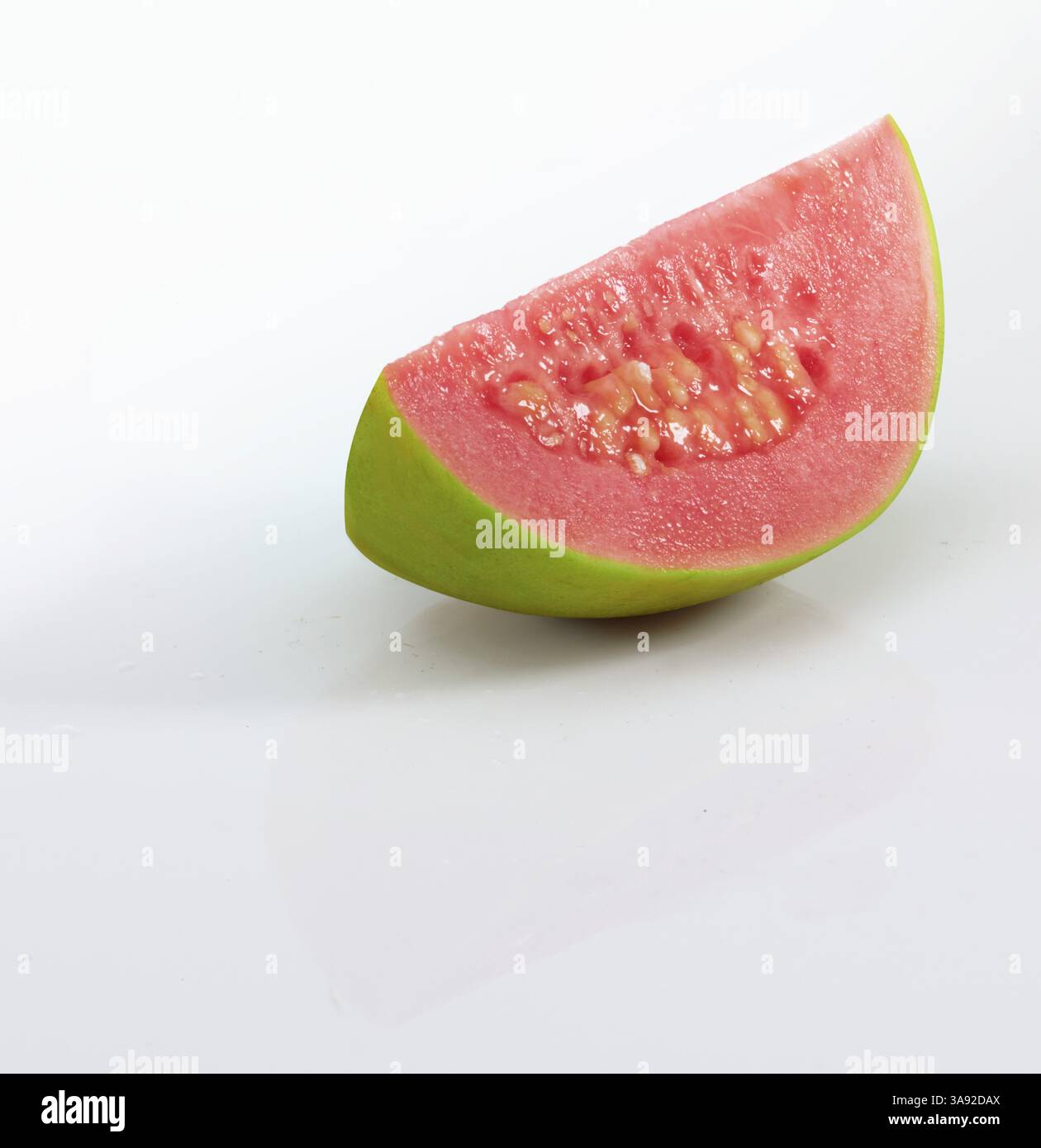 Quarter of a sliced guava (Psidium guajava Stock Photo - Alamy