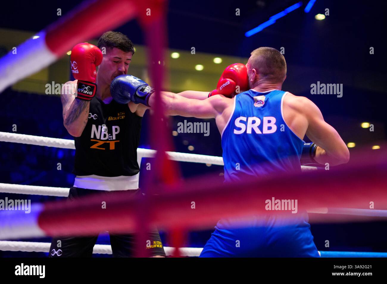 SCHWECHAT, AUSTRIA - MARCH 29: Marcel Meinl of Austria gets a punch ...