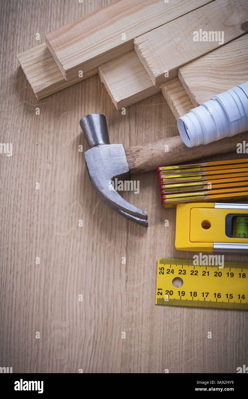 Vertical version of wooden studs and meter ruler blueprints hammer ...