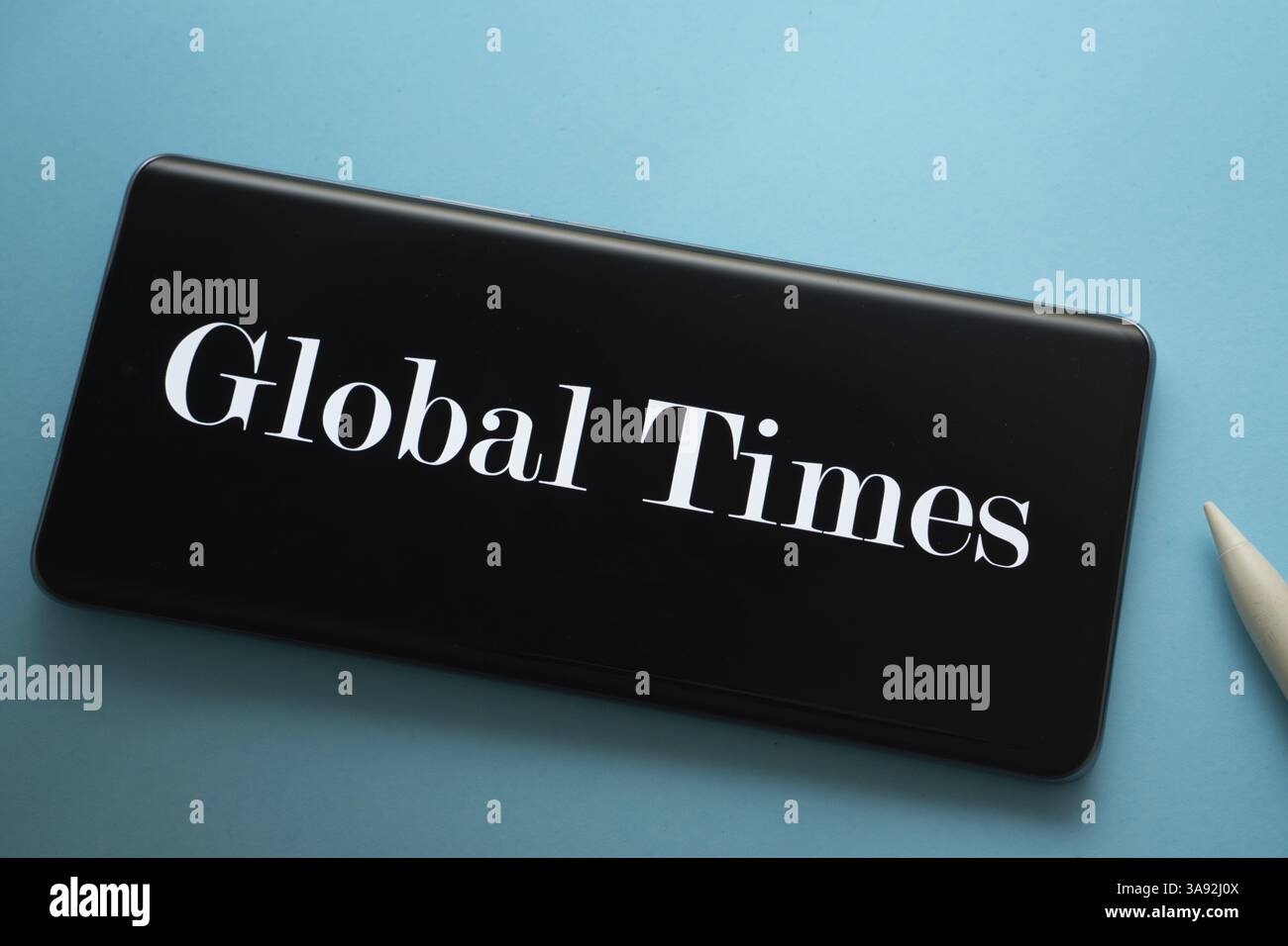 The logo of the Global Times is displayed on a smartphone screen Stock ...
