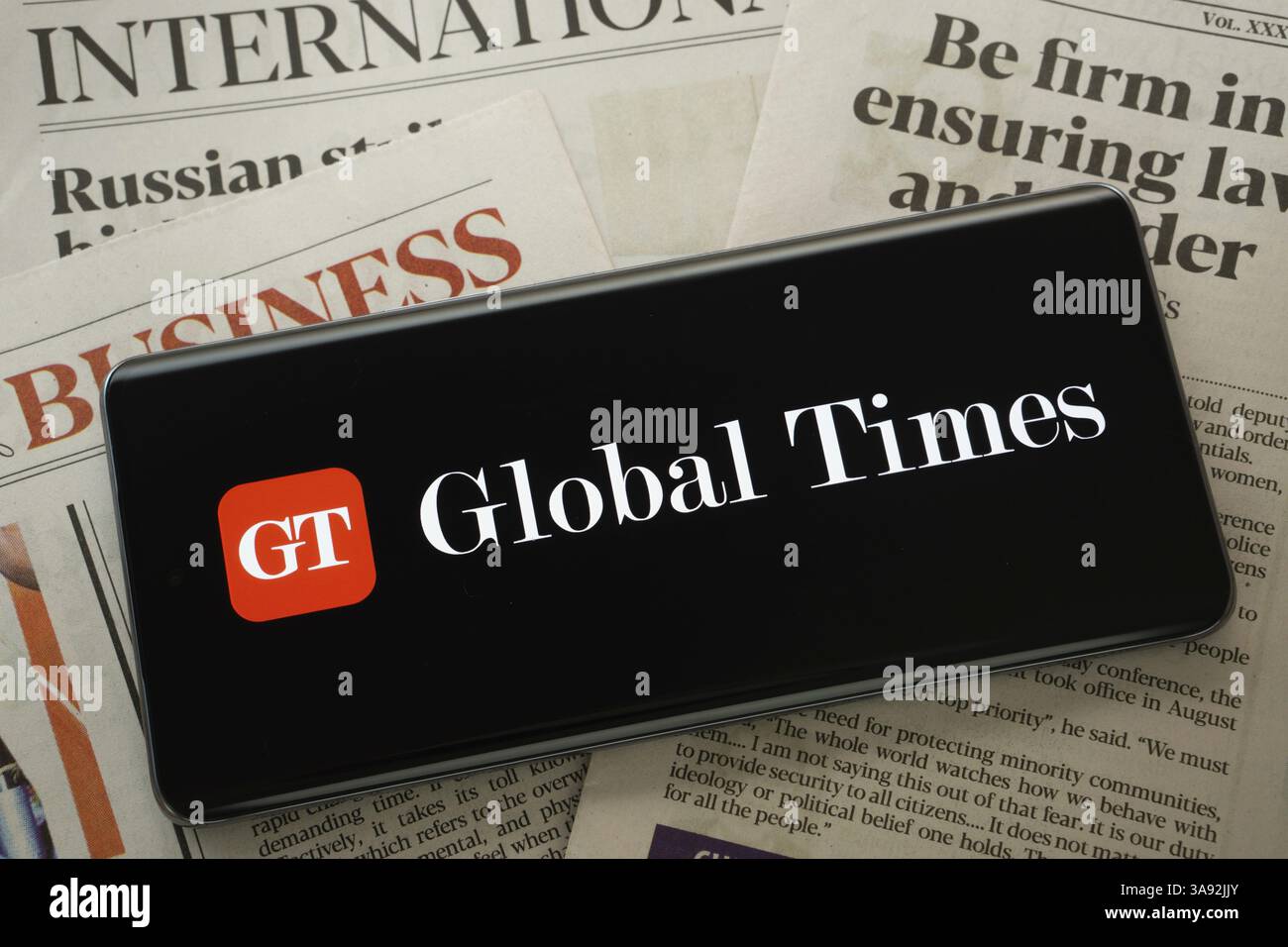 The logo of the newspaper Global Times is displayed on a smartphone ...