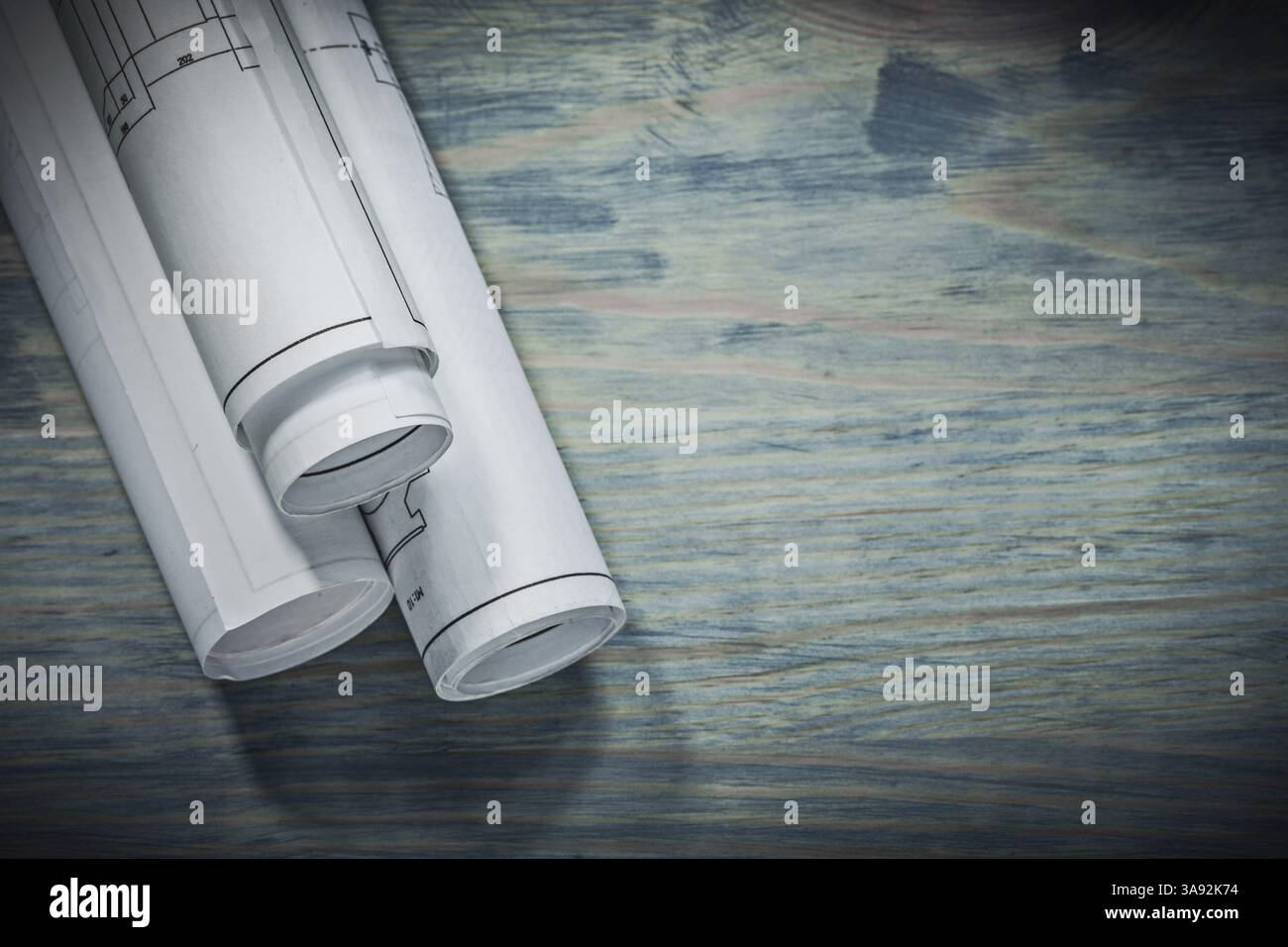 Three rolled blueprints close up Stock Photo - Alamy