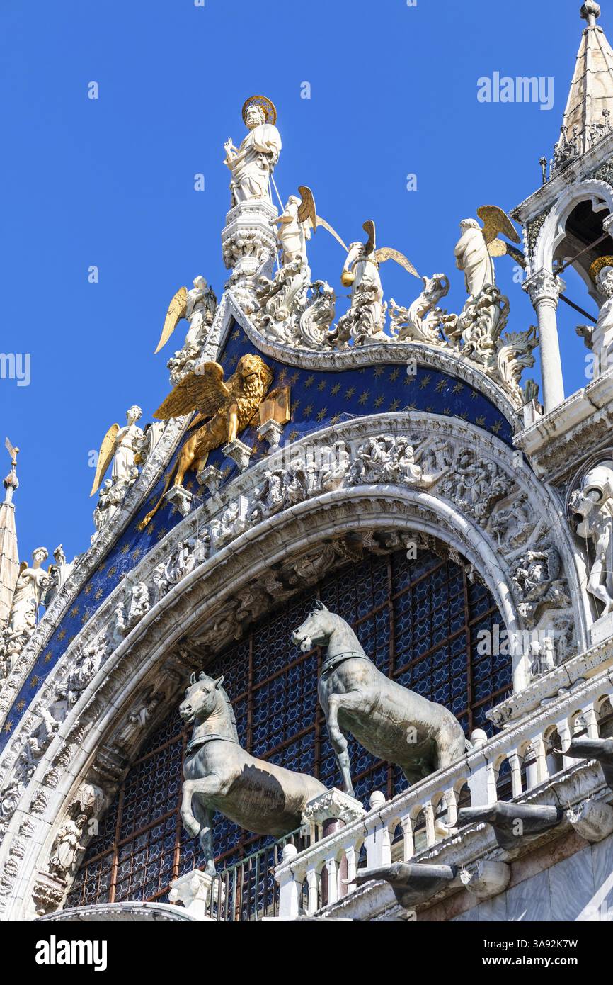 Figures of saints, statues, St Mark and the Lion of St Mark on the top ...