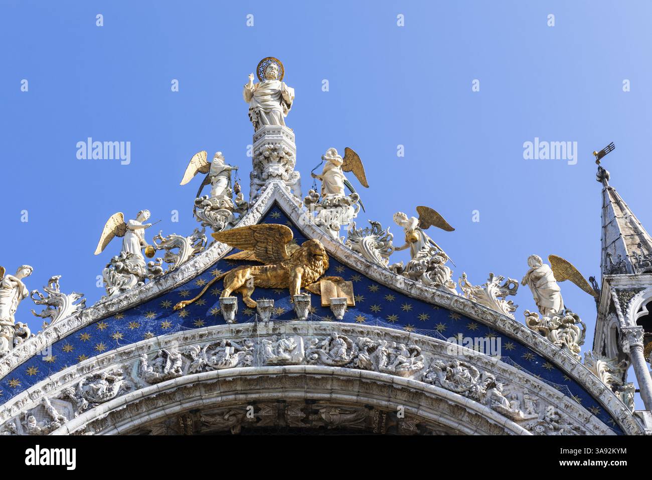 Figures of saints, statues, St Mark and the Lion of St Mark on the top ...