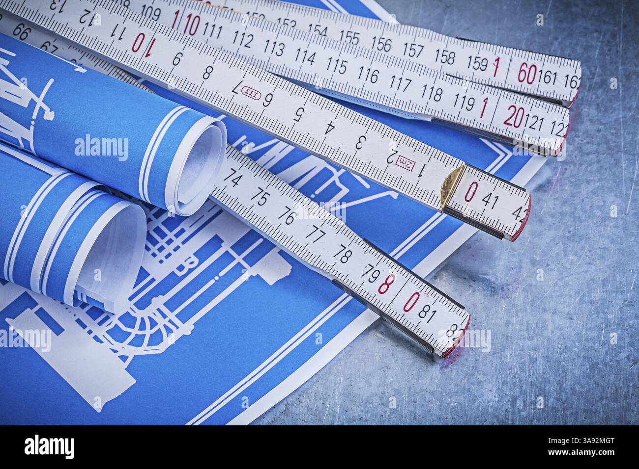 Set of blue engineering drawings wooden meter on metallic background ...