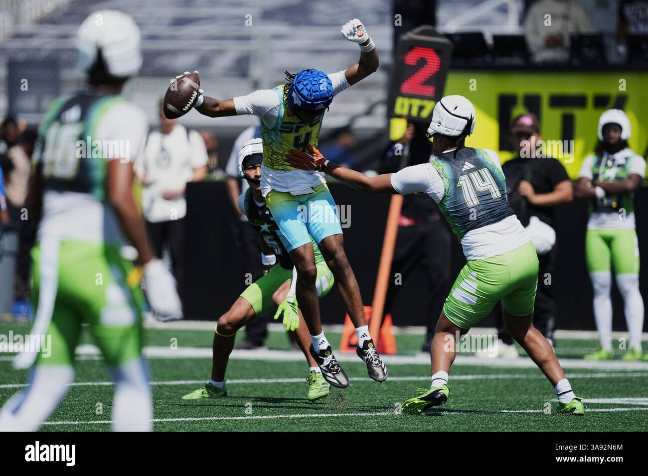 SFE wide receiver Kayden Dixon-Wyatt (14) is tagged by Trillion Boys ...