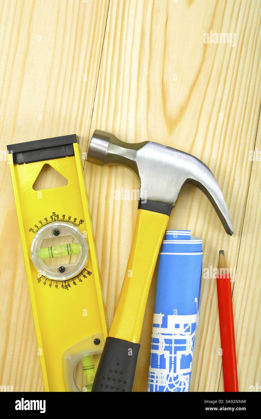 Composition of hammer blueprint pencil and level Stock Photo - Alamy