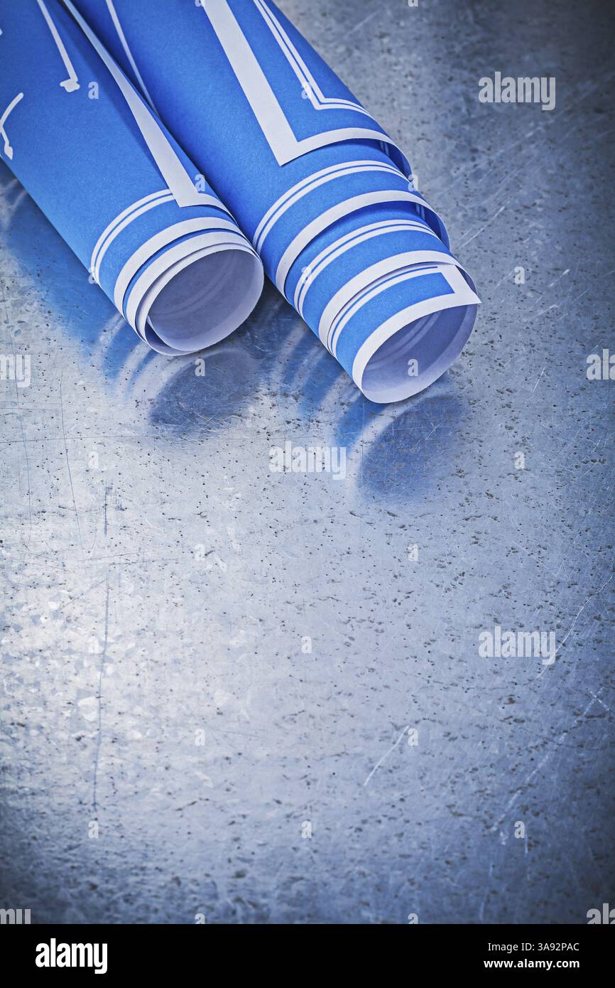 Heap of blue blueprints on metallic background building concept Stock ...