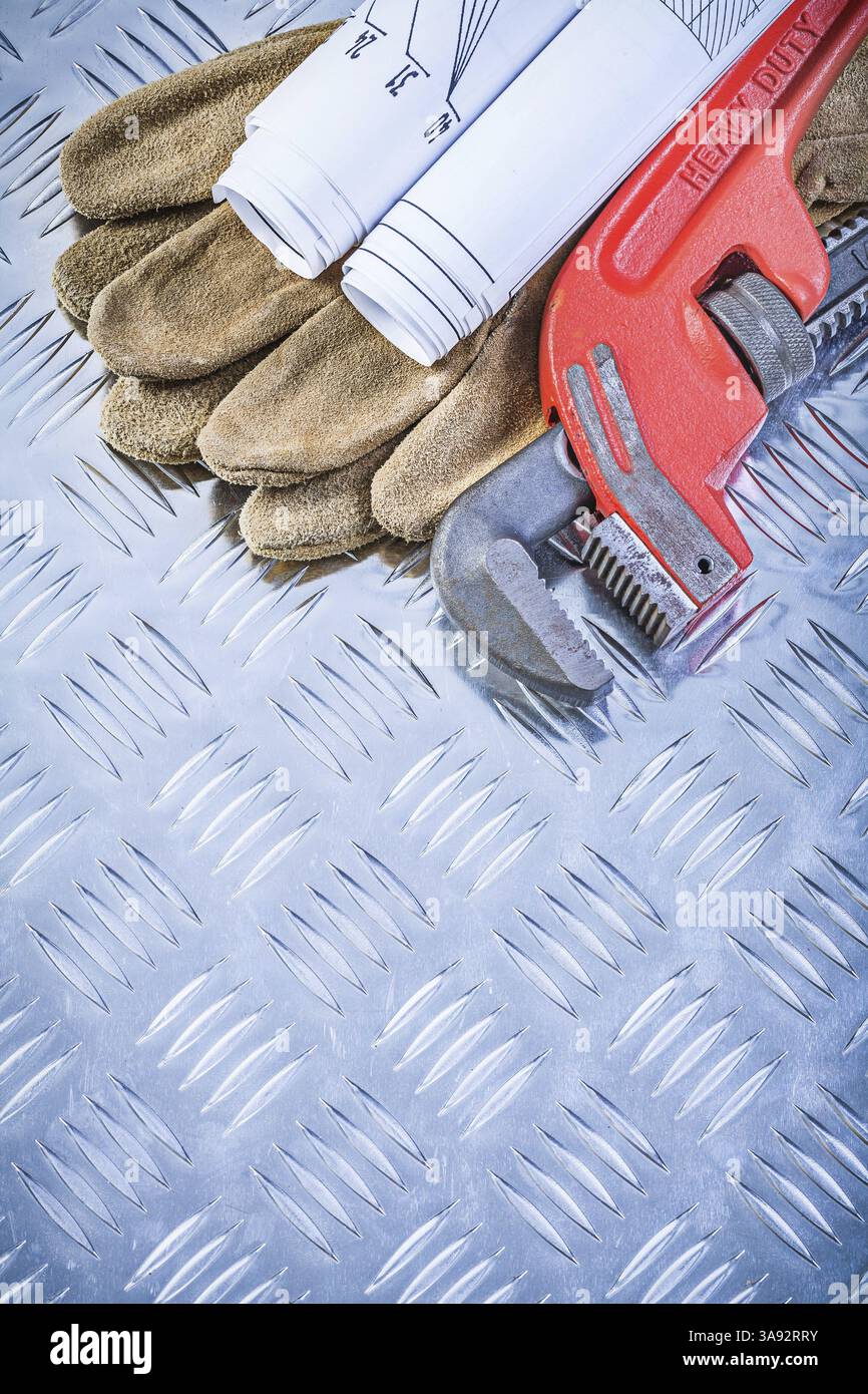 Set of pipe wrench engineering drawings leather protective gloves on ...