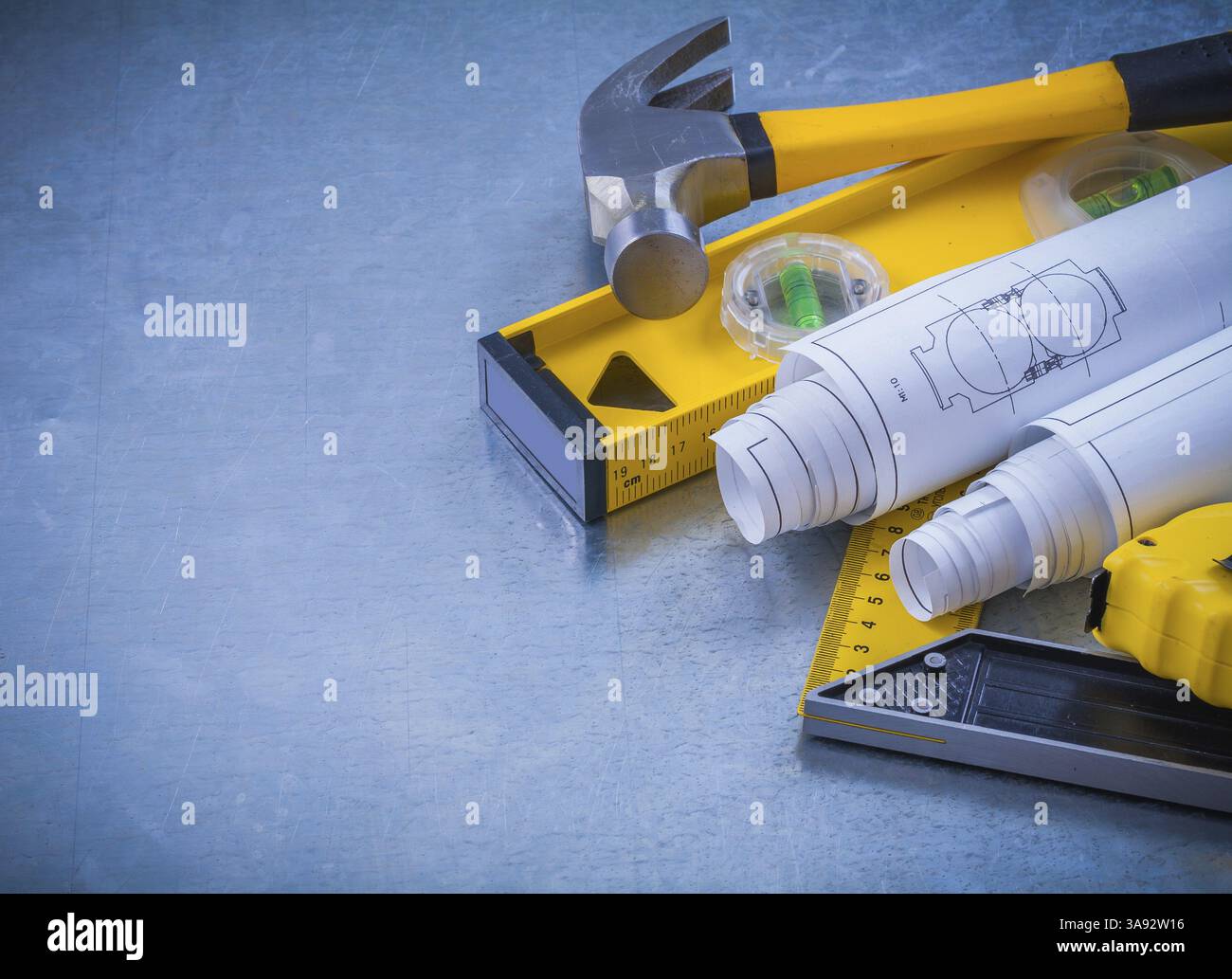 Hammer measuring line construction plans and level square ruler on ...