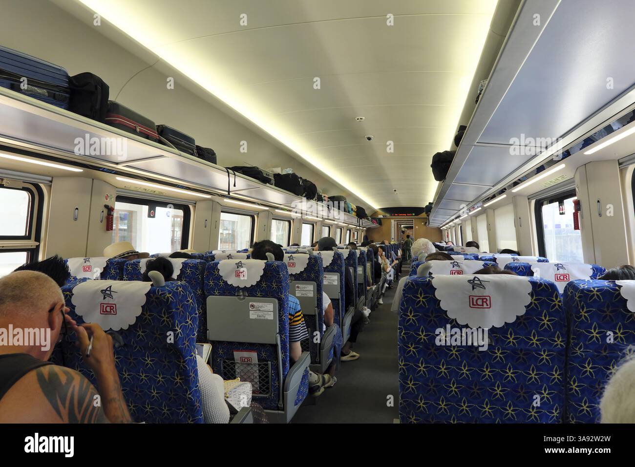 Interior view of a passenger coach of the express train of the Laos ...
