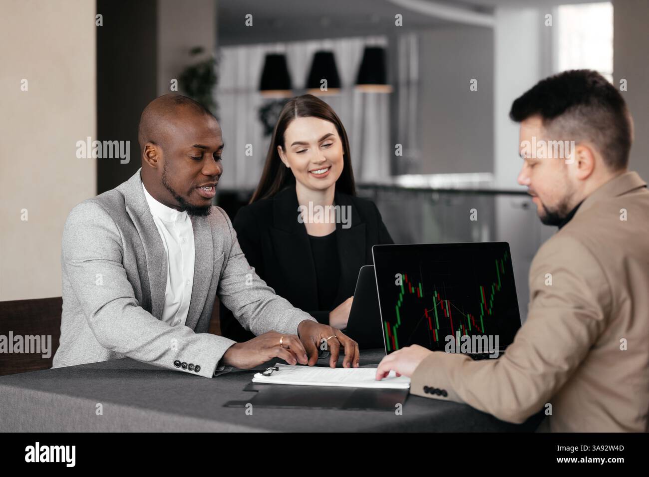 Meeting, collaboration and multiracial business people in discussion with a laptop for corporate ...