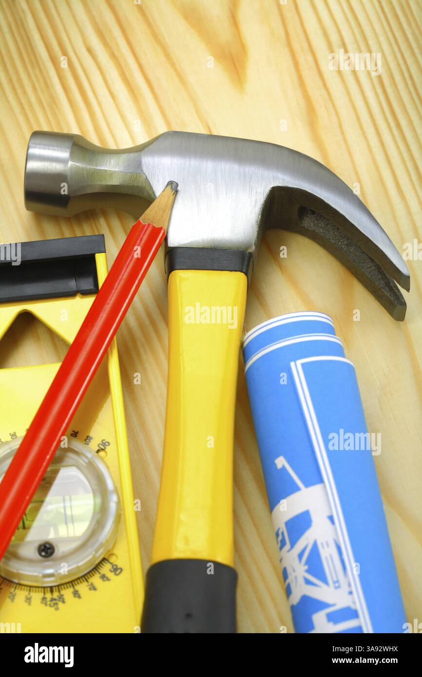 Hammer pencil blueprint level on wooden boards Stock Photo - Alamy