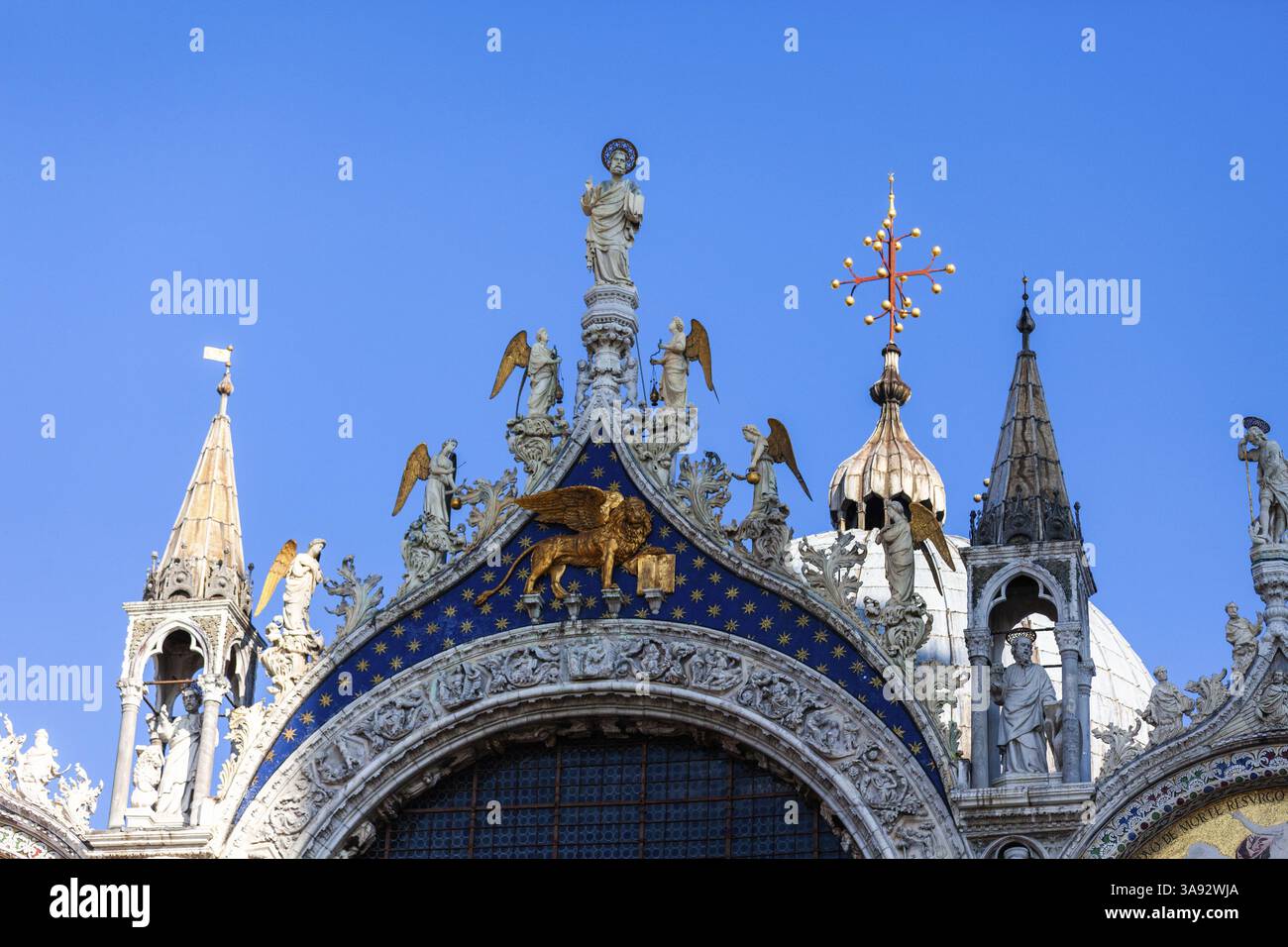 Figures of saints, statues, St Mark and the Lion of St Mark on the top ...